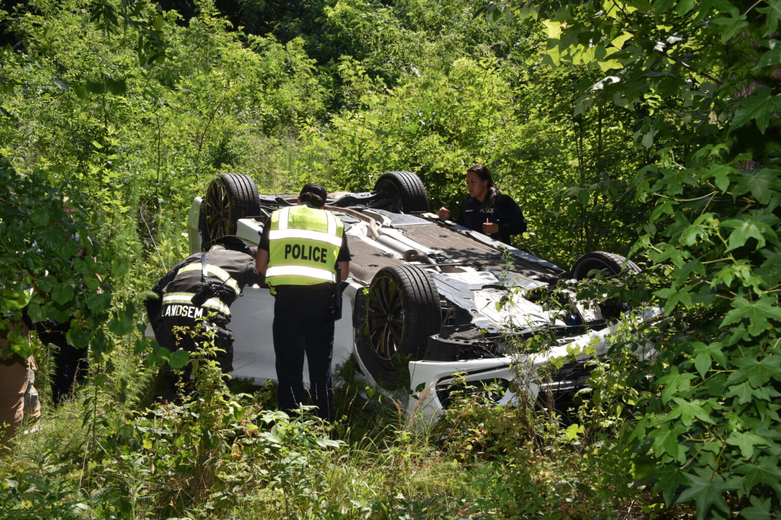 Troutman firefighters, police officers rescue motorist from overturned ...